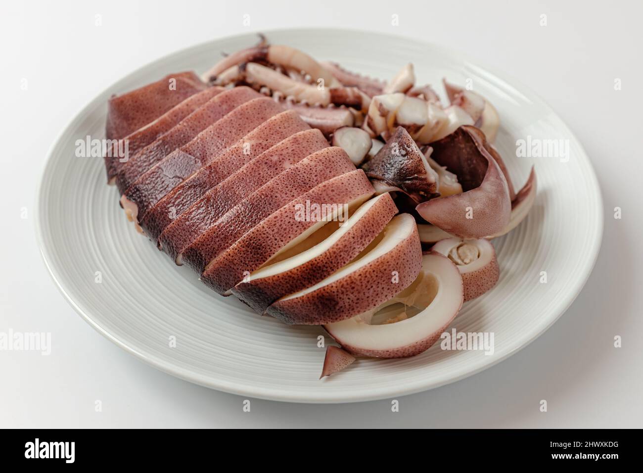 Roasted squid on a white background Stock Photo - Alamy