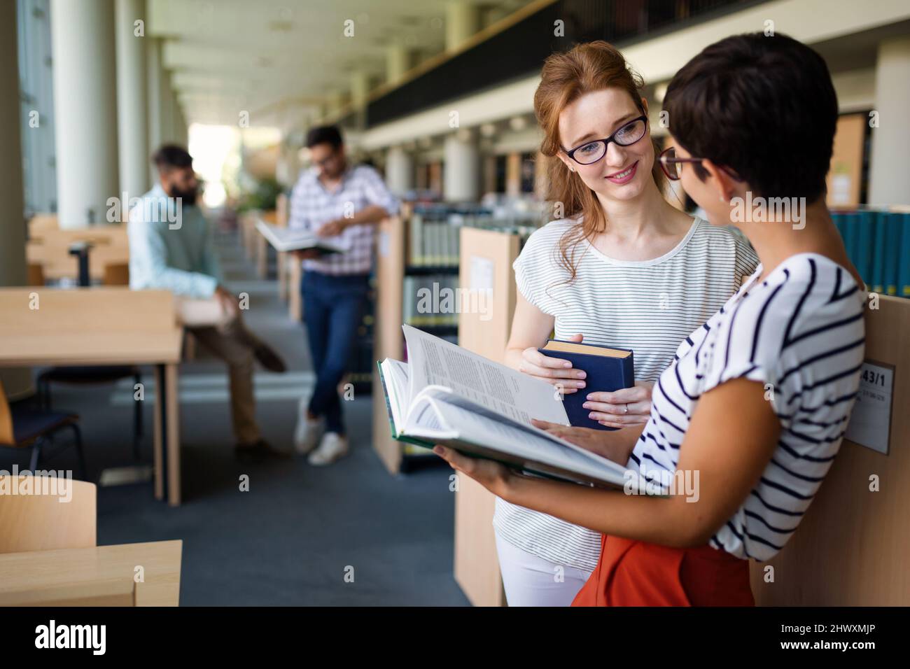 Happy group of success students studying and working together in a ...