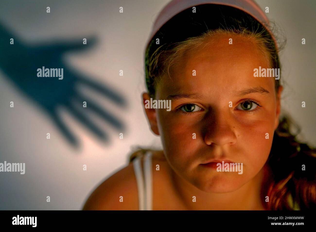 A Young girl Cowering away from her attacker (MODEL RELEASED Stock ...