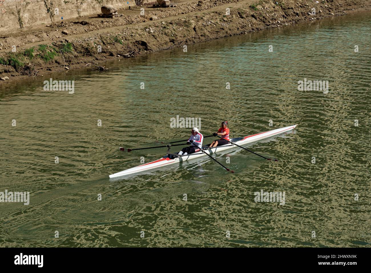 Elderly couple rowing along the River Arno in Florence Stock Photo - Alamy