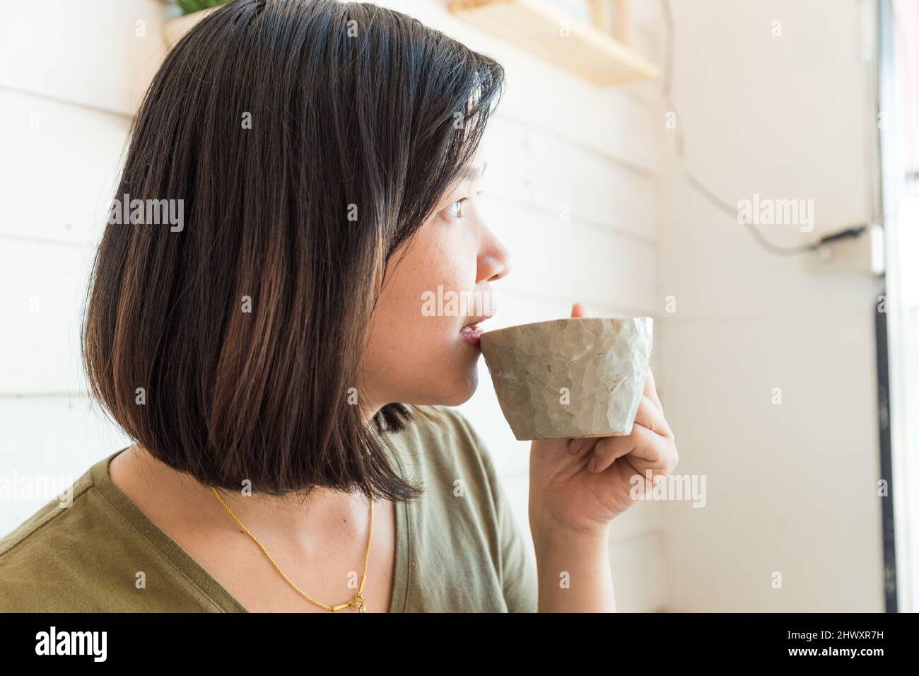Beautiful business women drinking latte art coffee in white cafe Stock ...