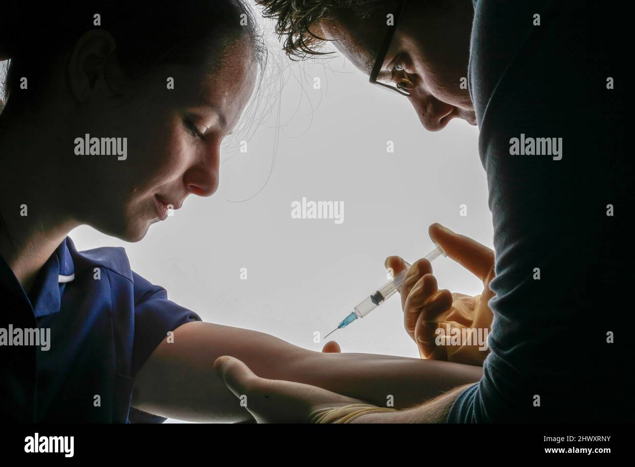 A Doctor taking blood from a young girls arm(MODEL RELEASED Stock Photo ...