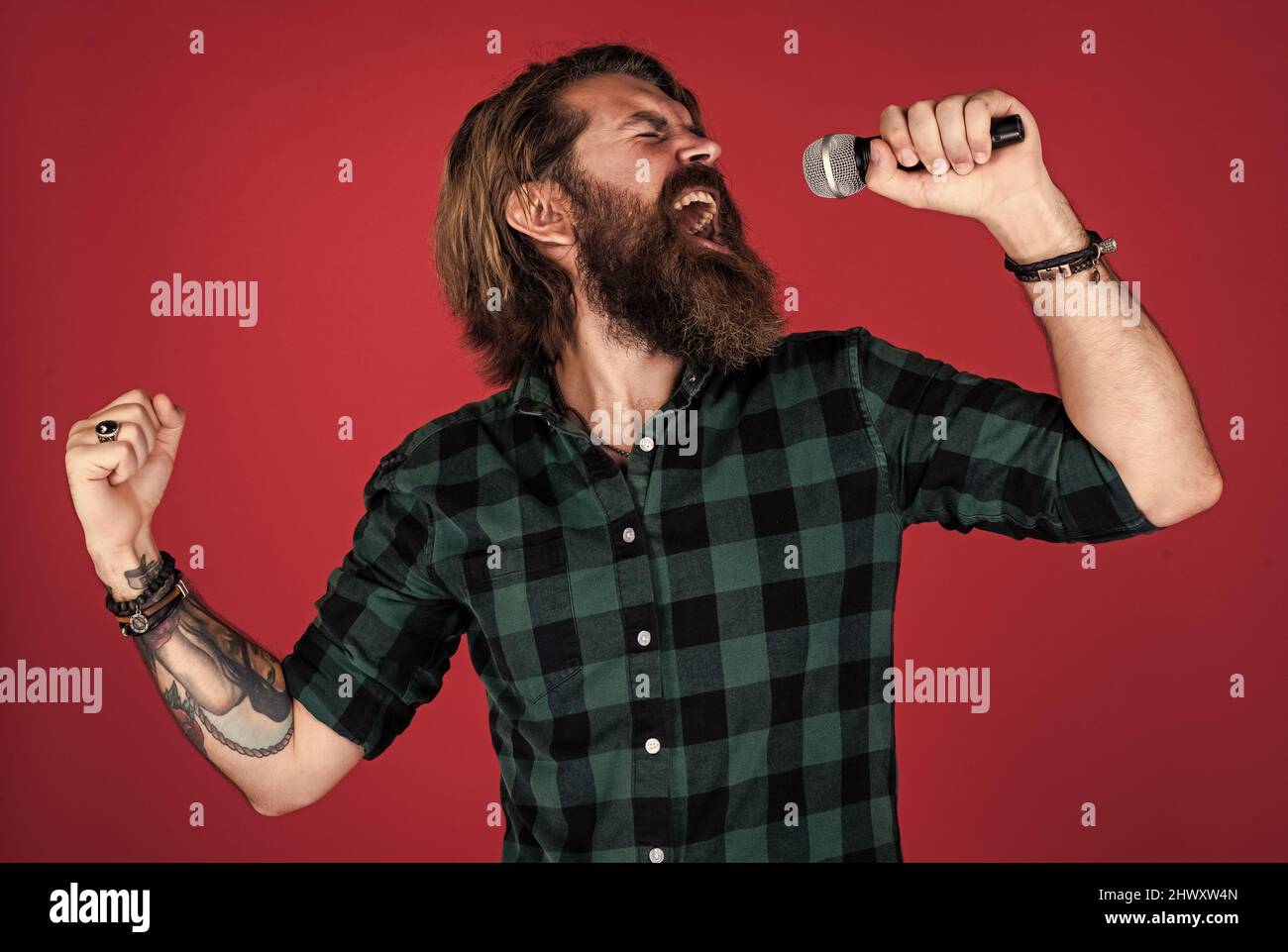 Face the music. brutal handsome man with moustache singing. mature guy ...