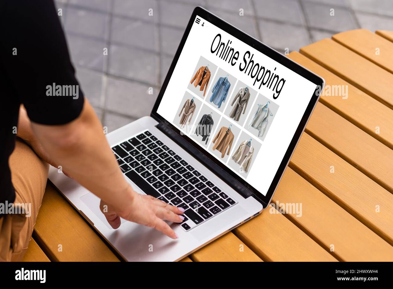 shopping, technology and internet concept: shopping with laptop ...