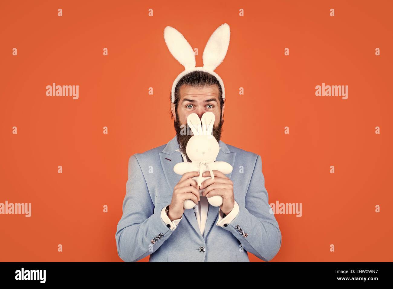 last preparations. brutal man having fun. mature male wear rabbit ears ...