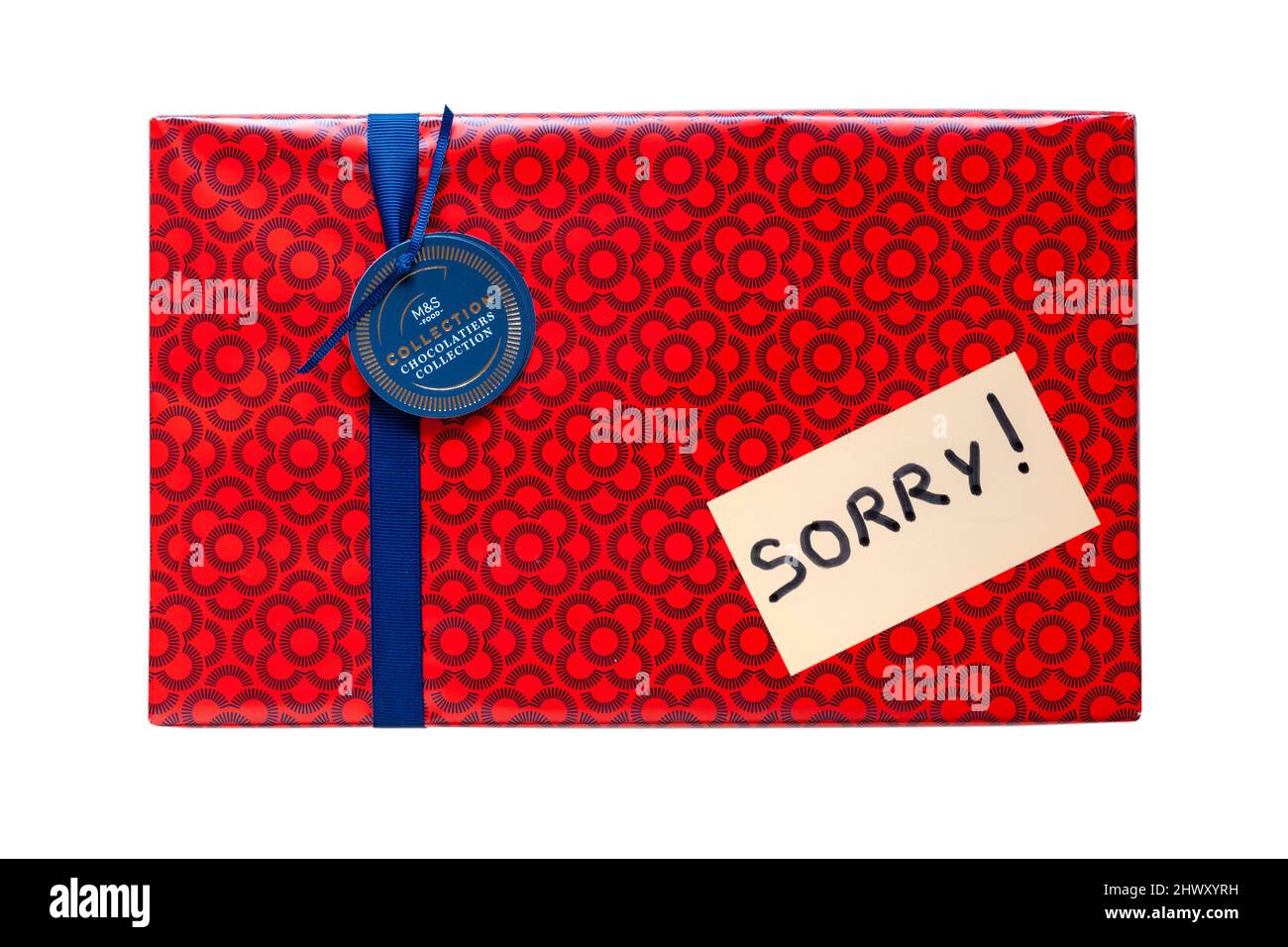 Box of M&S Chocolatiers collection chocolates with sorry card isolated ...