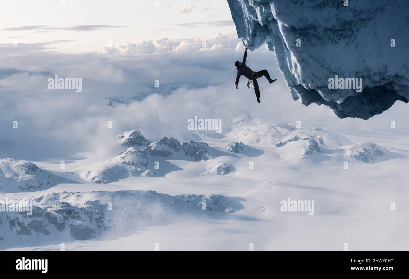 Adult adventurous man Rock Climbing a steep rocky cliff Stock Photo - Alamy