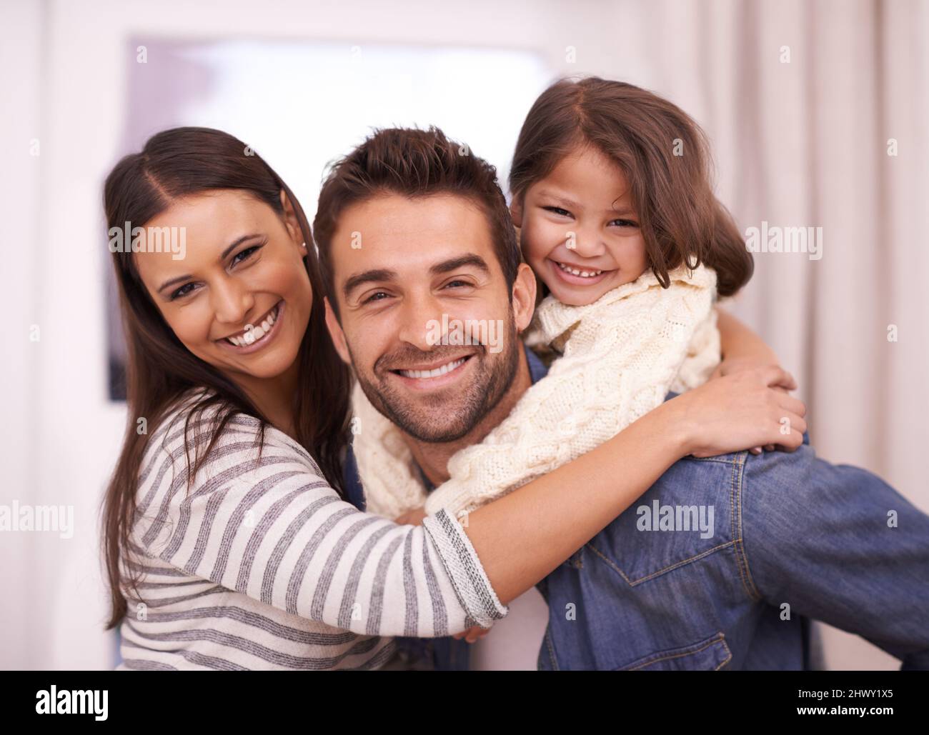 Family is lifes greatest blessing. Portrait of a happy young family at ...