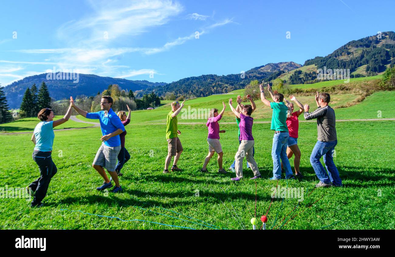 High Five after a successful teambuilding exercise Stock Photo - Alamy