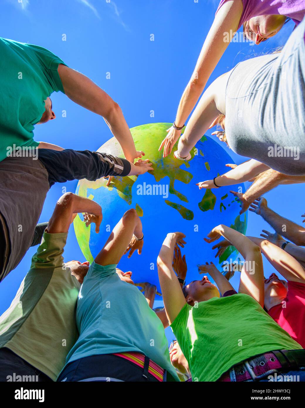 Carrying the world on hands Stock Photo - Alamy