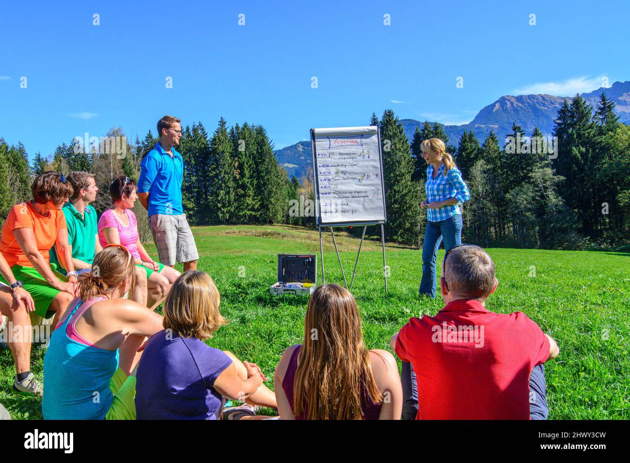 A group at a teambuilding training course Stock Photo - Alamy