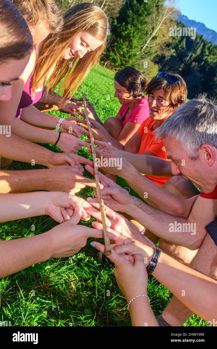 A group during a team-building exercise - teamwork ultimately brings ...