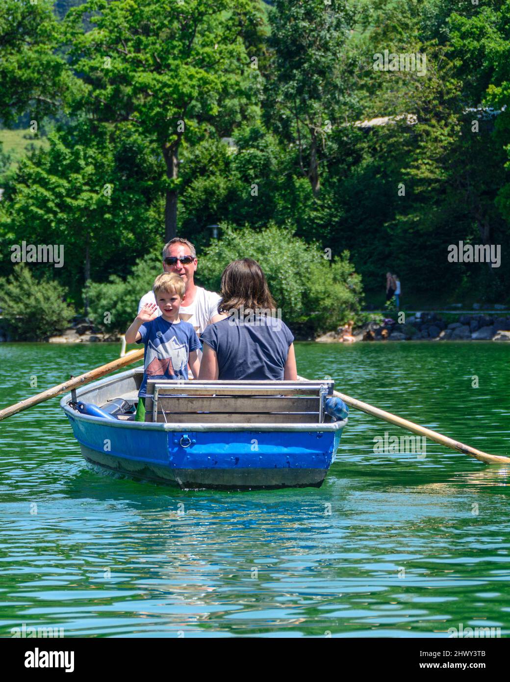 Family tour with rowboat on Alpsee in bavarian Allgäu Stock Photo - Alamy