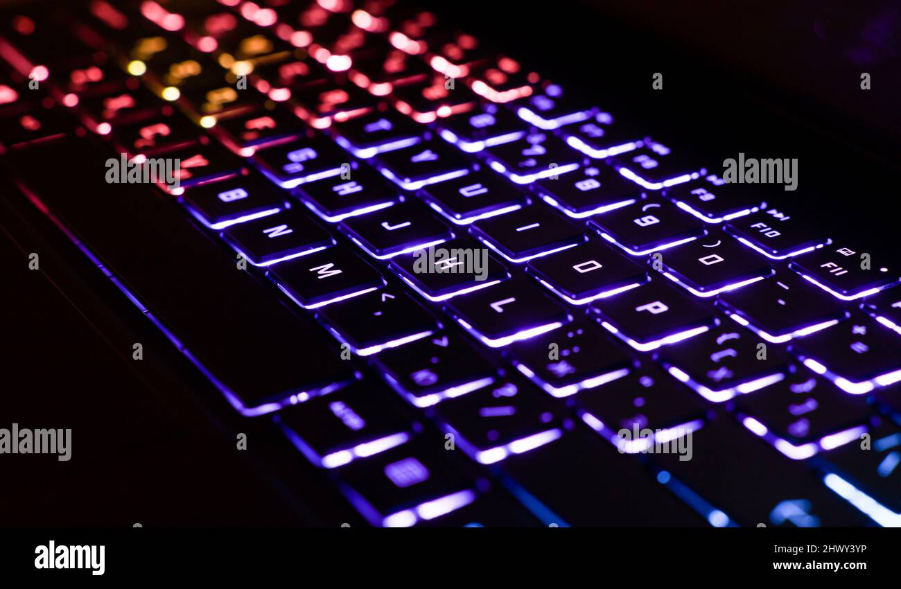 Neon computer keyboard with color backlight. Computer video games ...