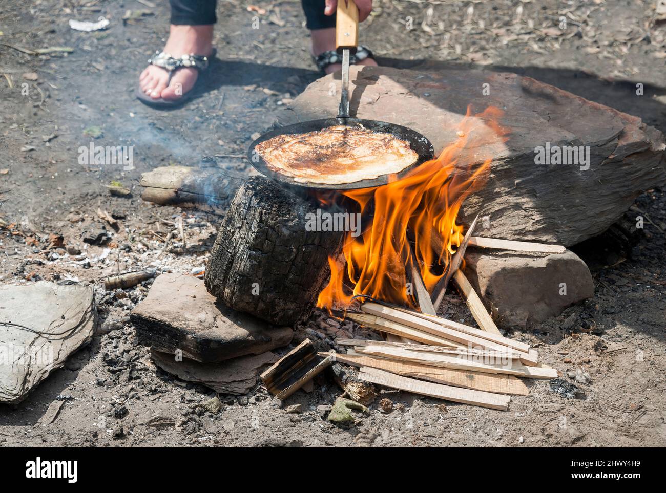 making pancake on the campfire Stock Photo - Alamy