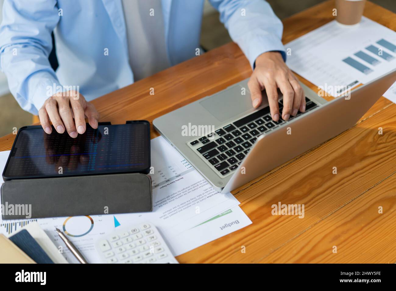 Business analyst concept the businessman using both computer laptop and ...
