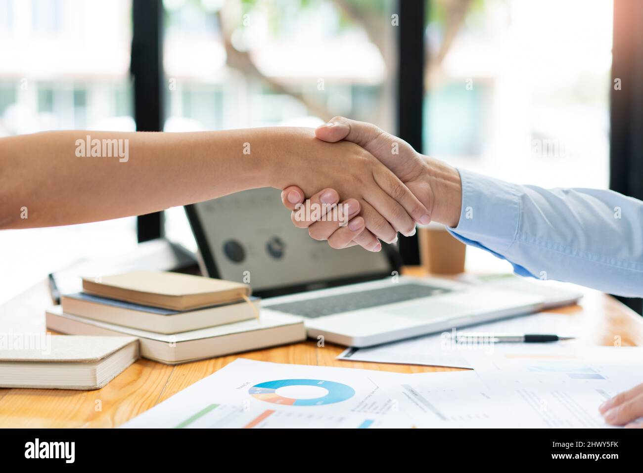 Business negotiation concept the estate representatives shaking hand ...