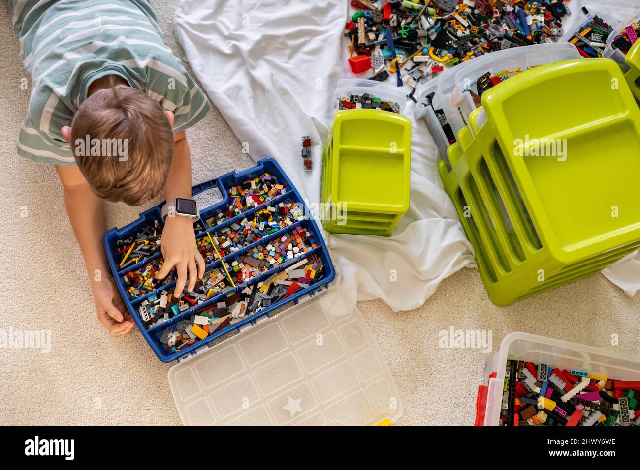 Khabarovsk, Russia, February 18, 2022. Teenager male sorting heap of ...