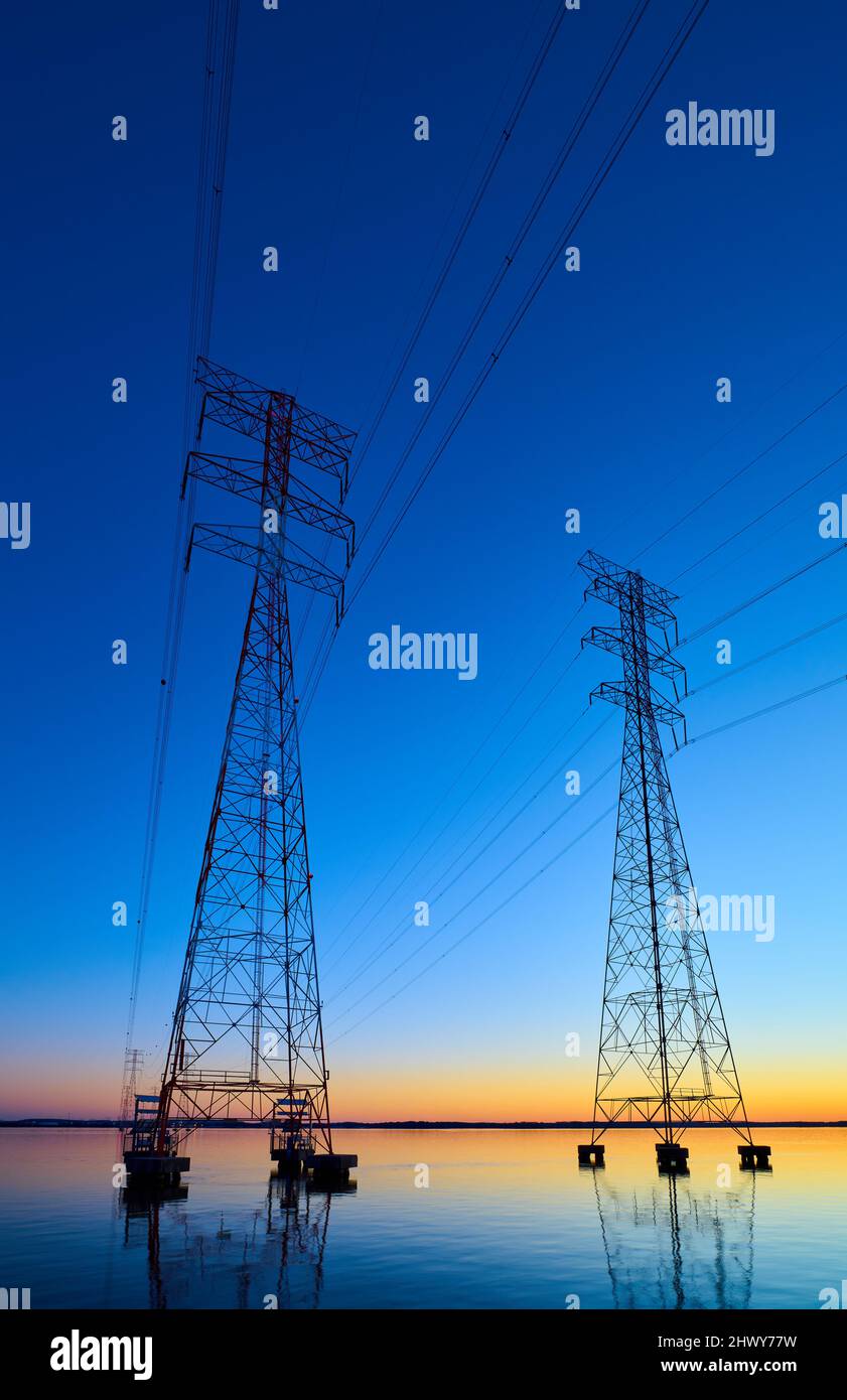 High voltage transmission lines crossing Wheeler Lake at dusk near ...