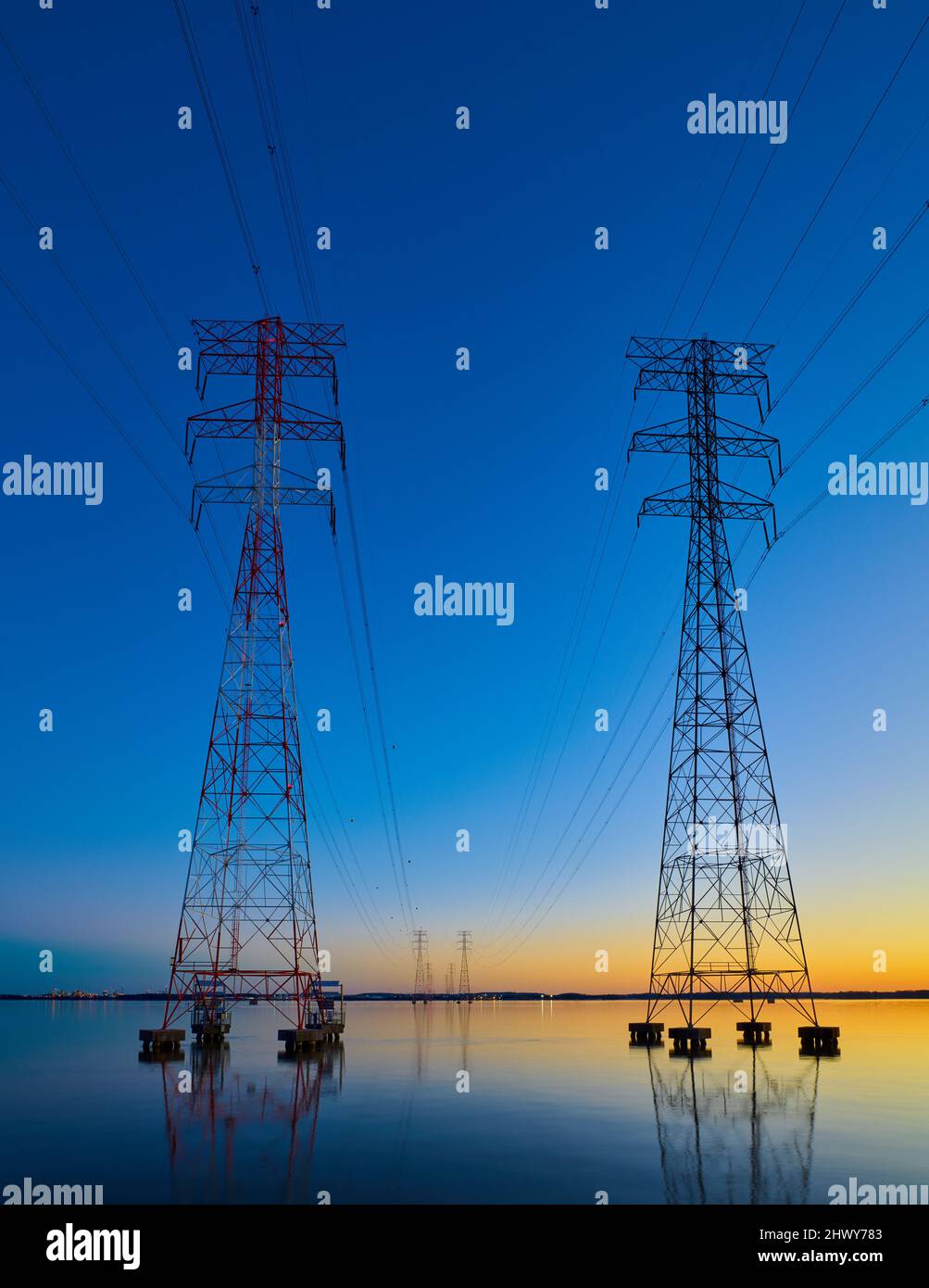 High voltage transmission lines crossing Wheeler Lake at dusk near ...
