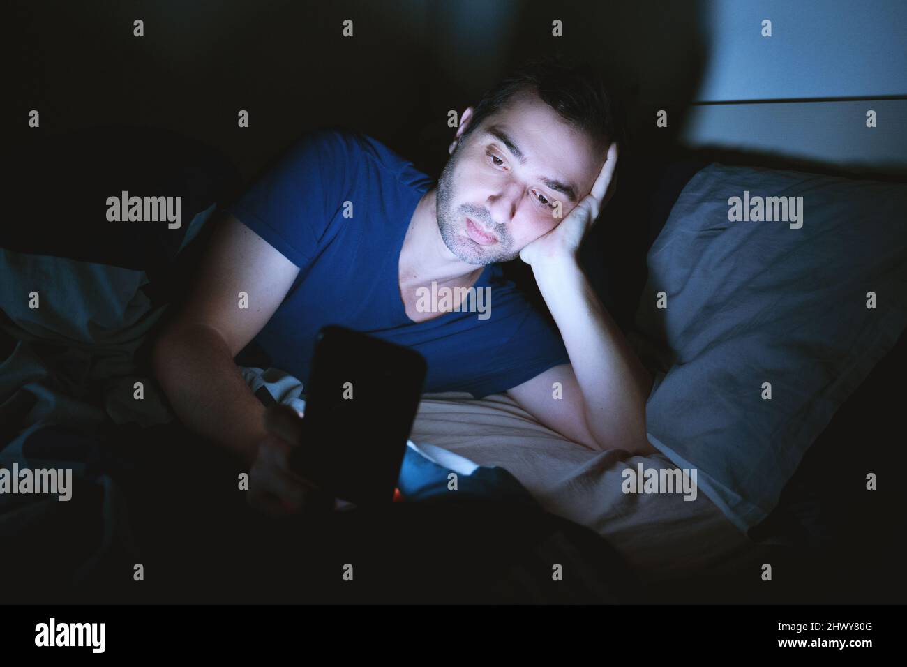 Man lit by phone hi-res stock photography and images - Alamy