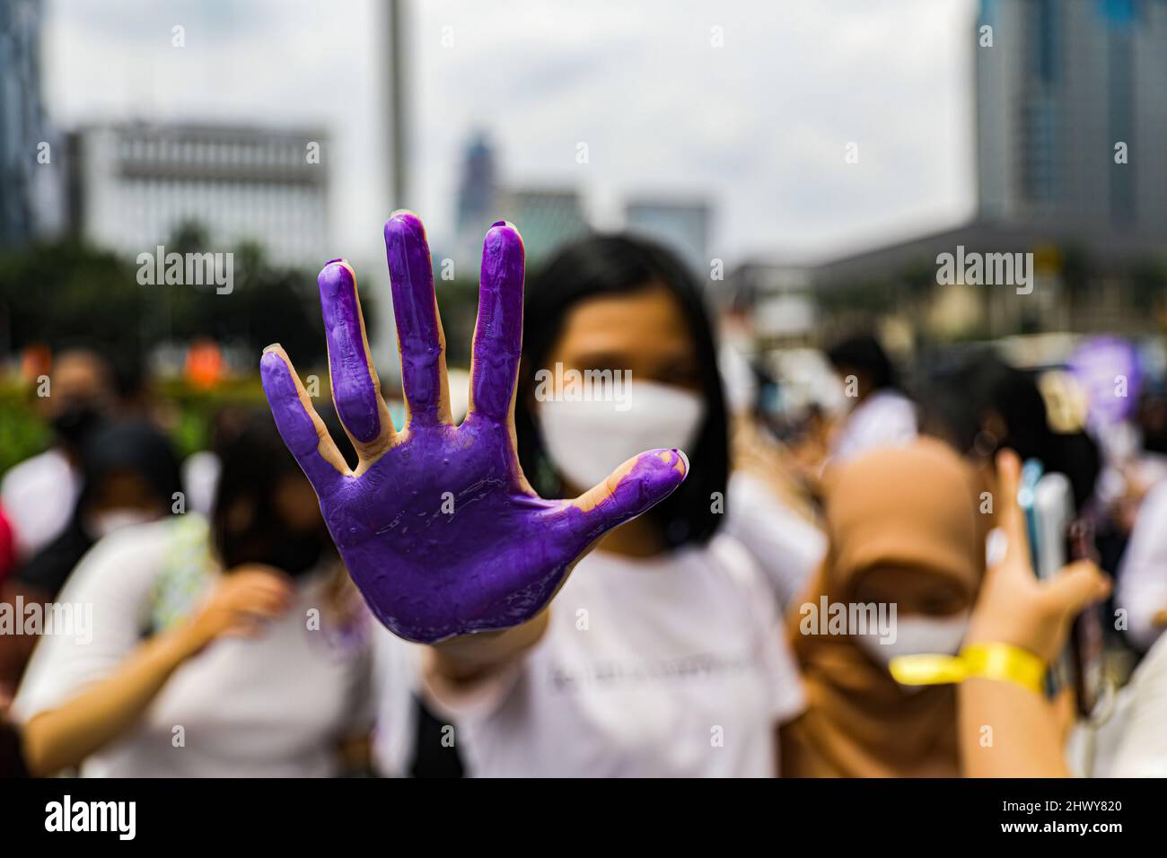 A woman seen with ink on her hand during the protest on International ...