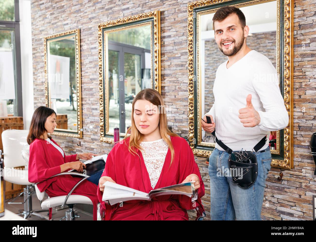 Portrait of man professional hairdresser near woman client with ...