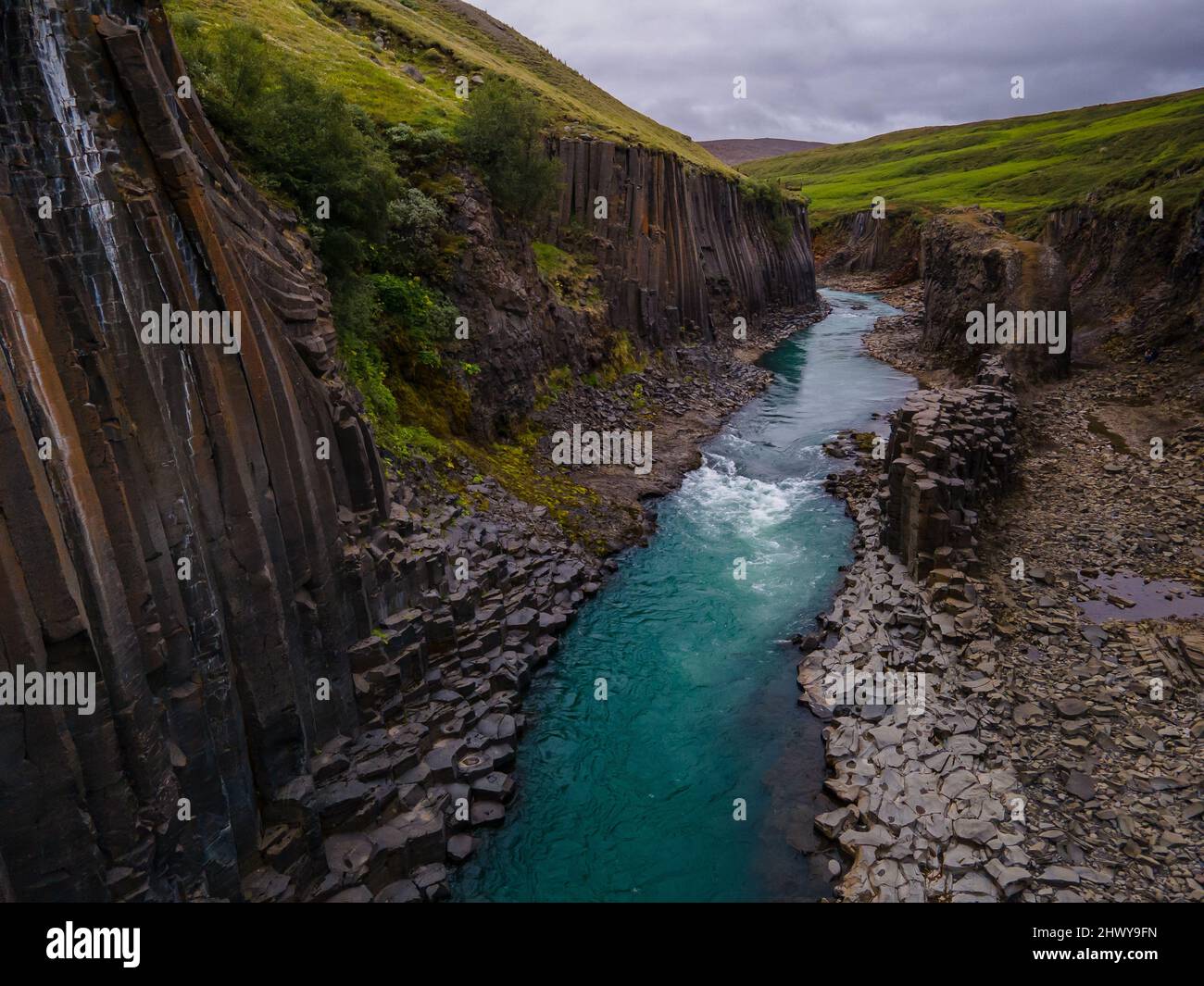 Beautiful aerial view of the studlagil canyon, and the largest number of basalt rock columns in ...