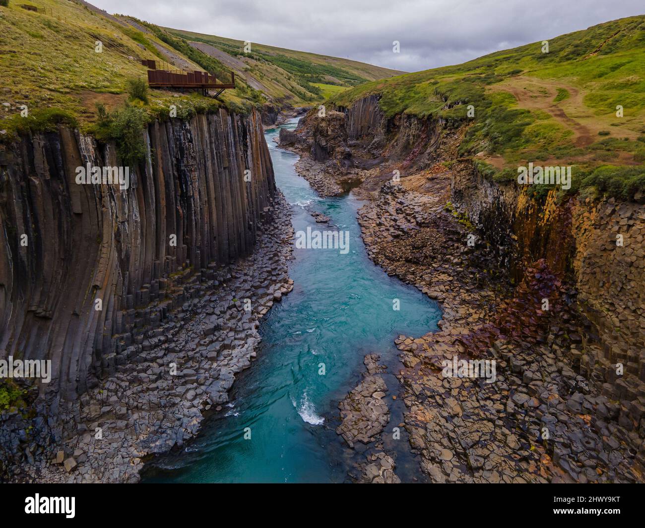 Beautiful aerial view of the studlagil canyon, and the largest number of basalt rock columns in ...