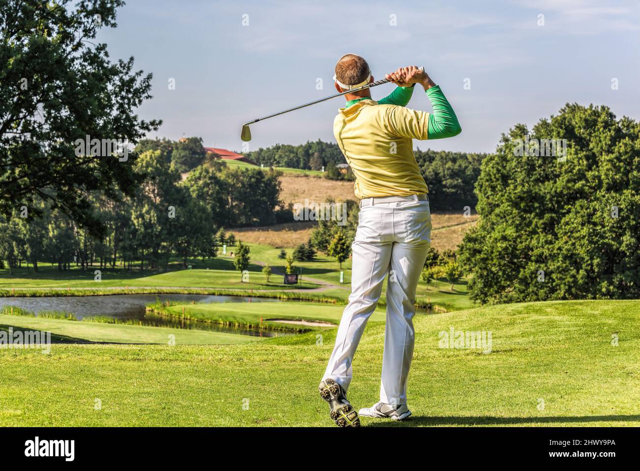 Man playing golf Stock Photo - Alamy