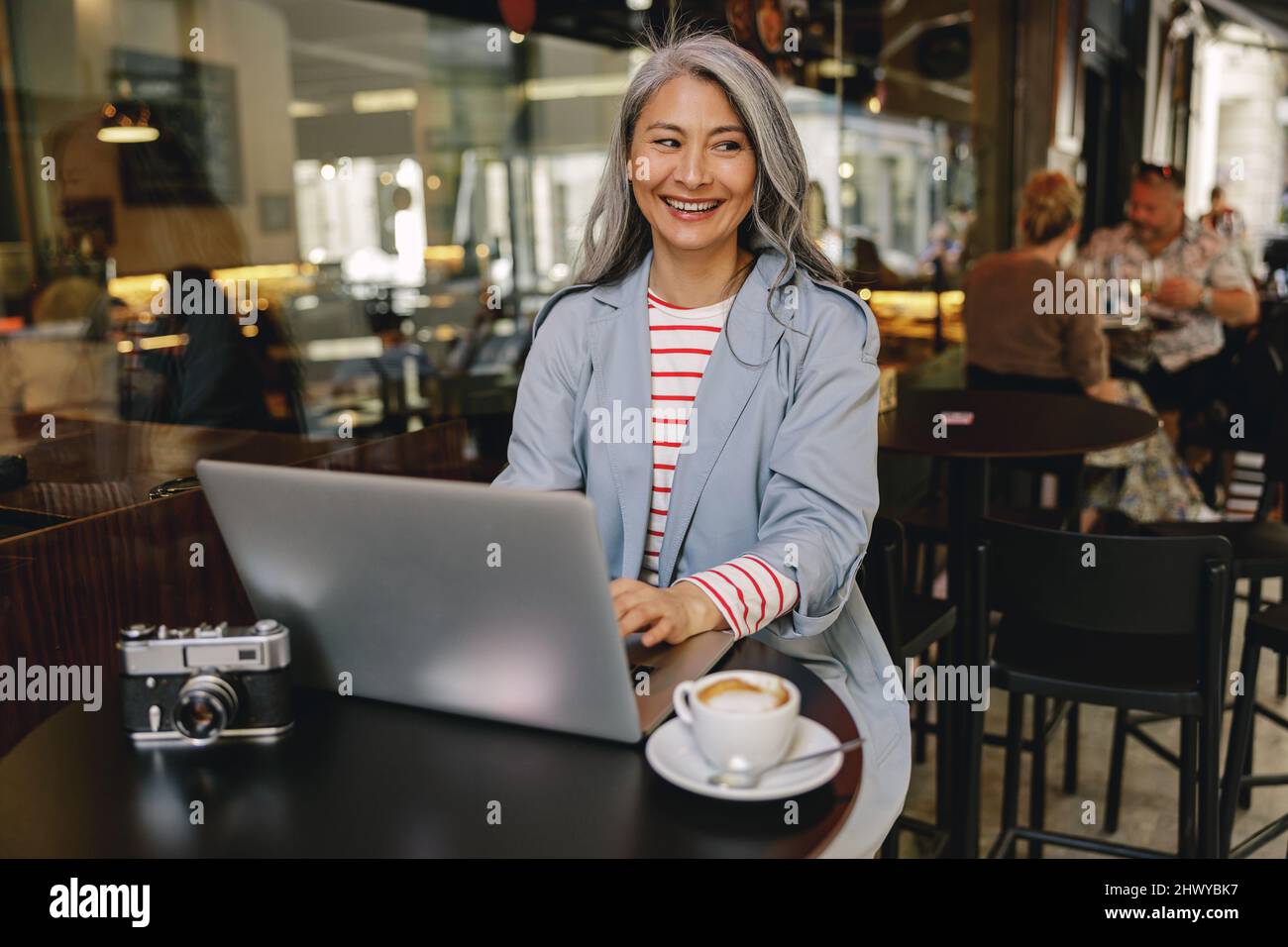Confident female with happy face posing indoors Stock Photo - Alamy