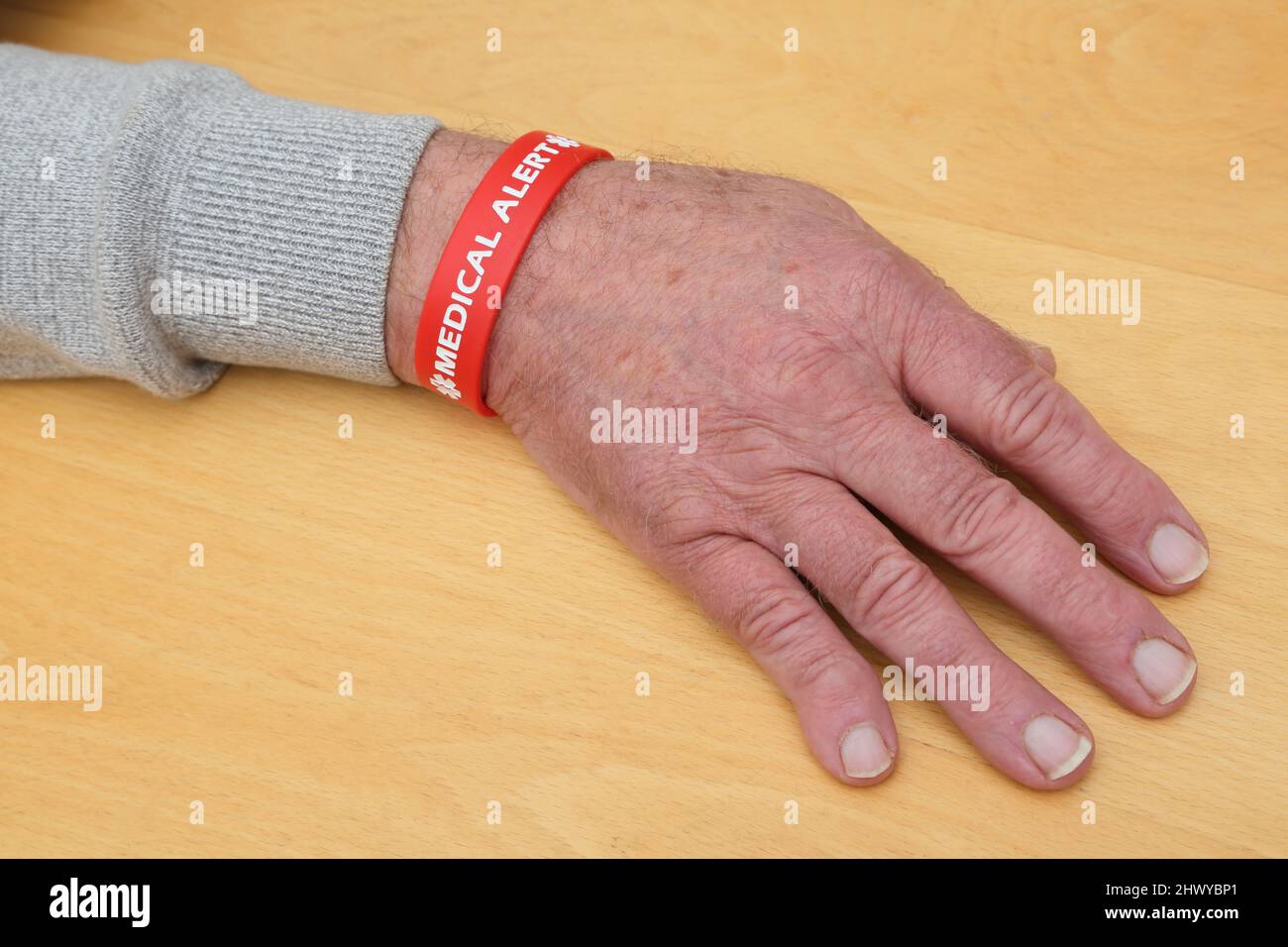 Red Silicone Medical Alert Bracelet Stock Photo - Alamy