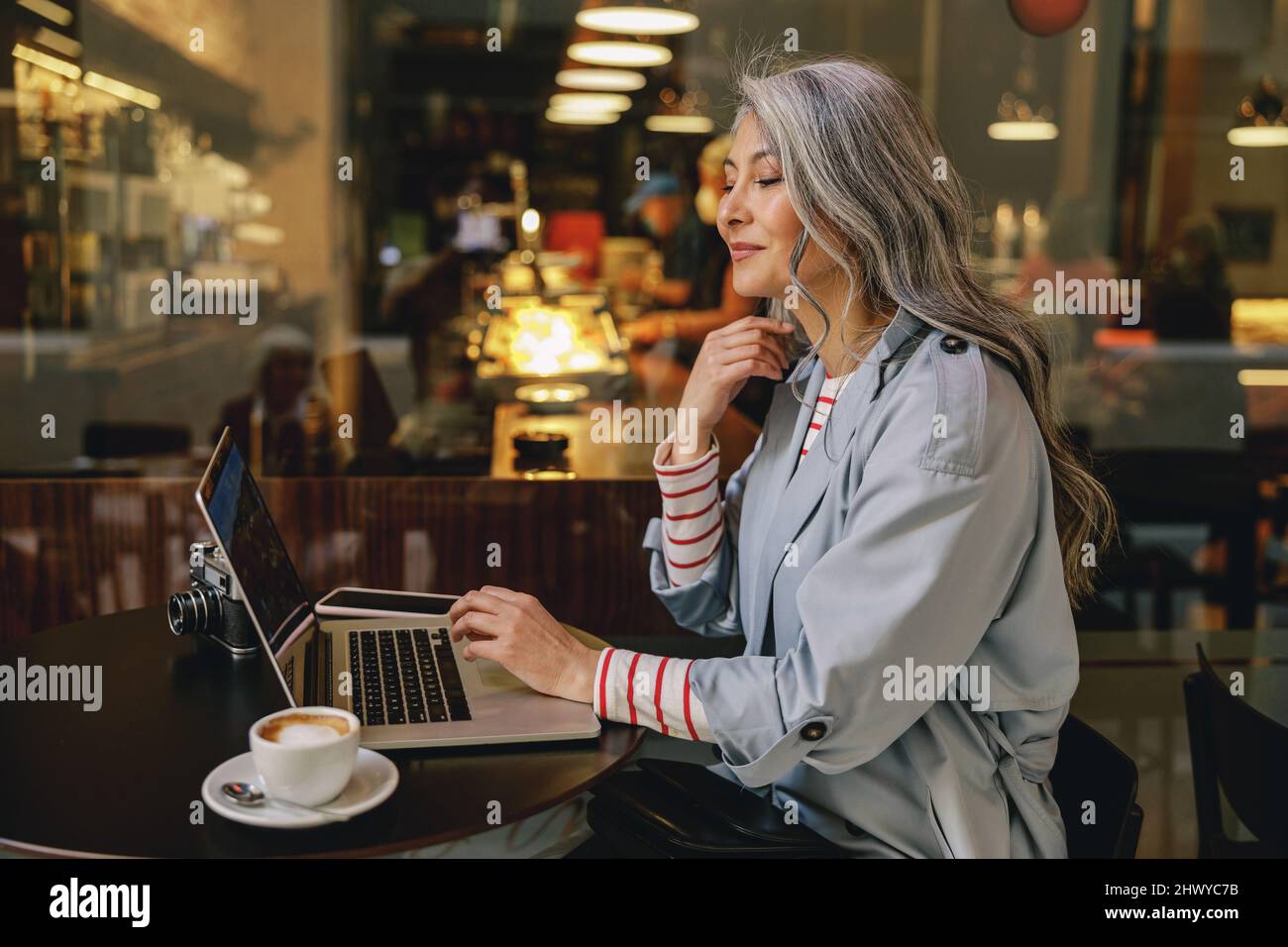 Confident woman with happy face posing indoors Stock Photo - Alamy