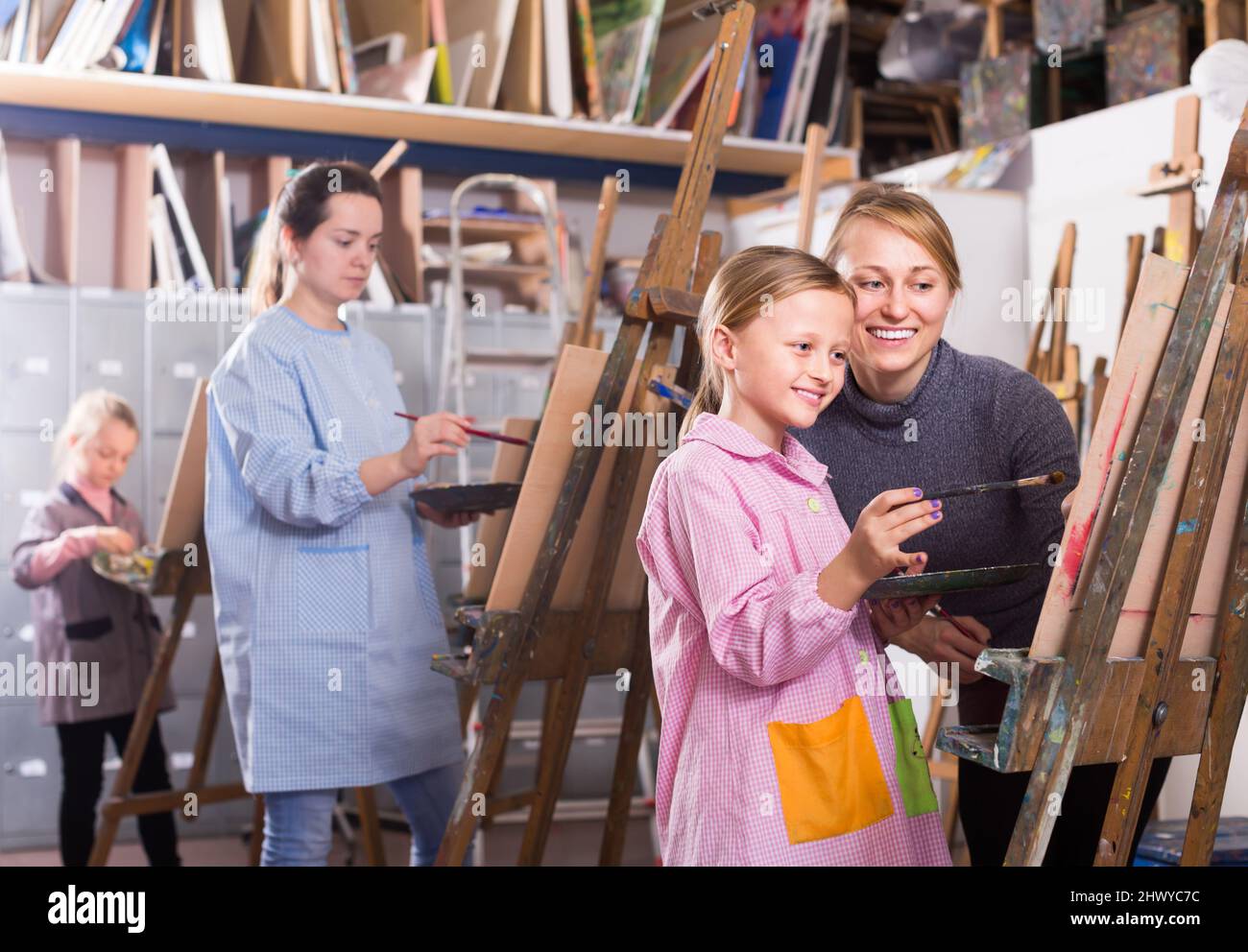 Young female pupils practicing their skills during painting Stock Photo ...