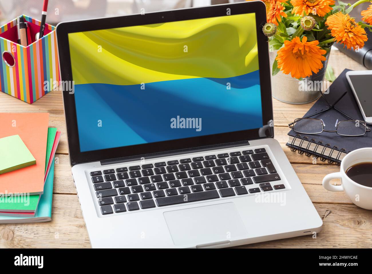 Support Ukraine, donate help Ukrainian people. flag on computer laptop ...
