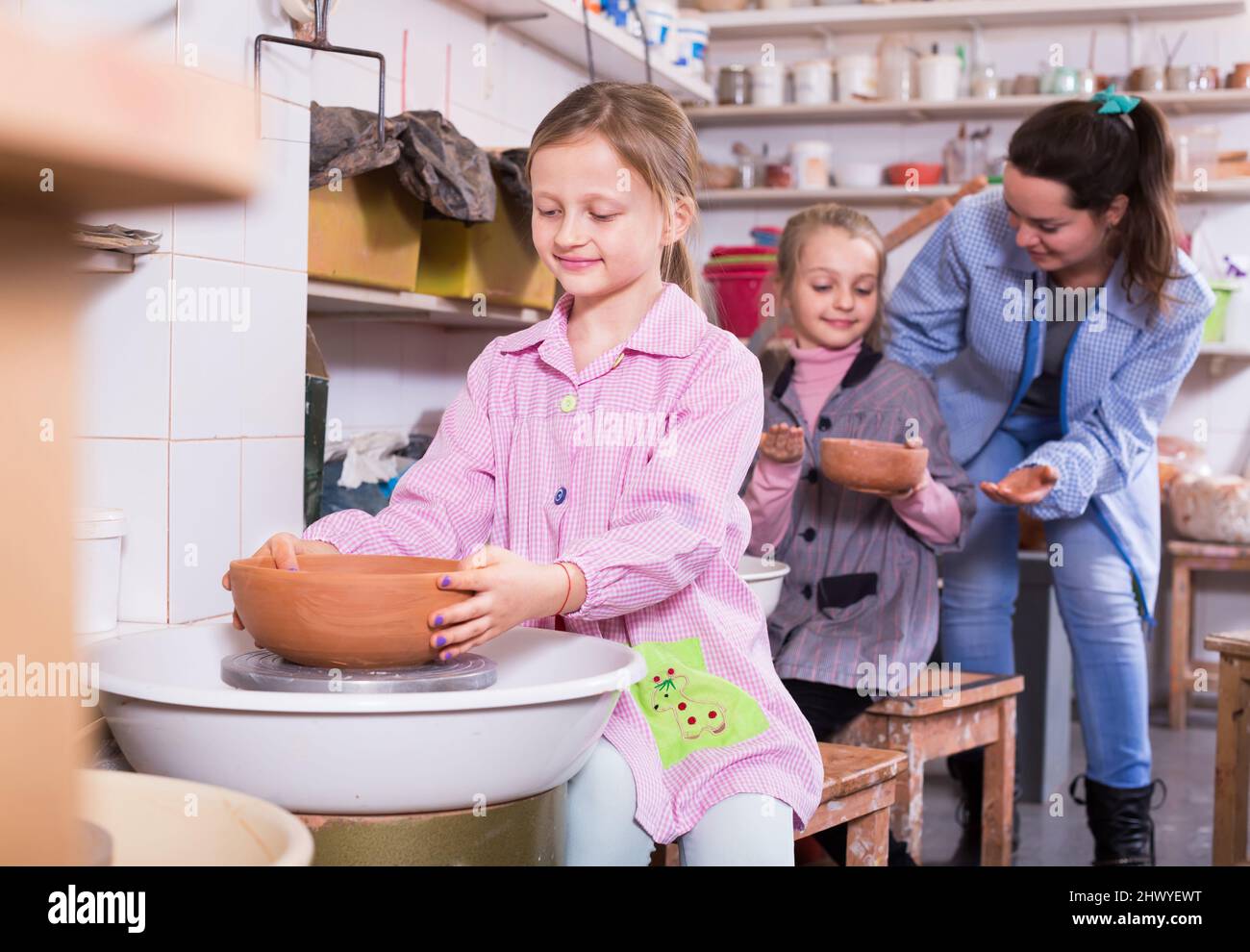 Children working in pottery Stock Photo - Alamy