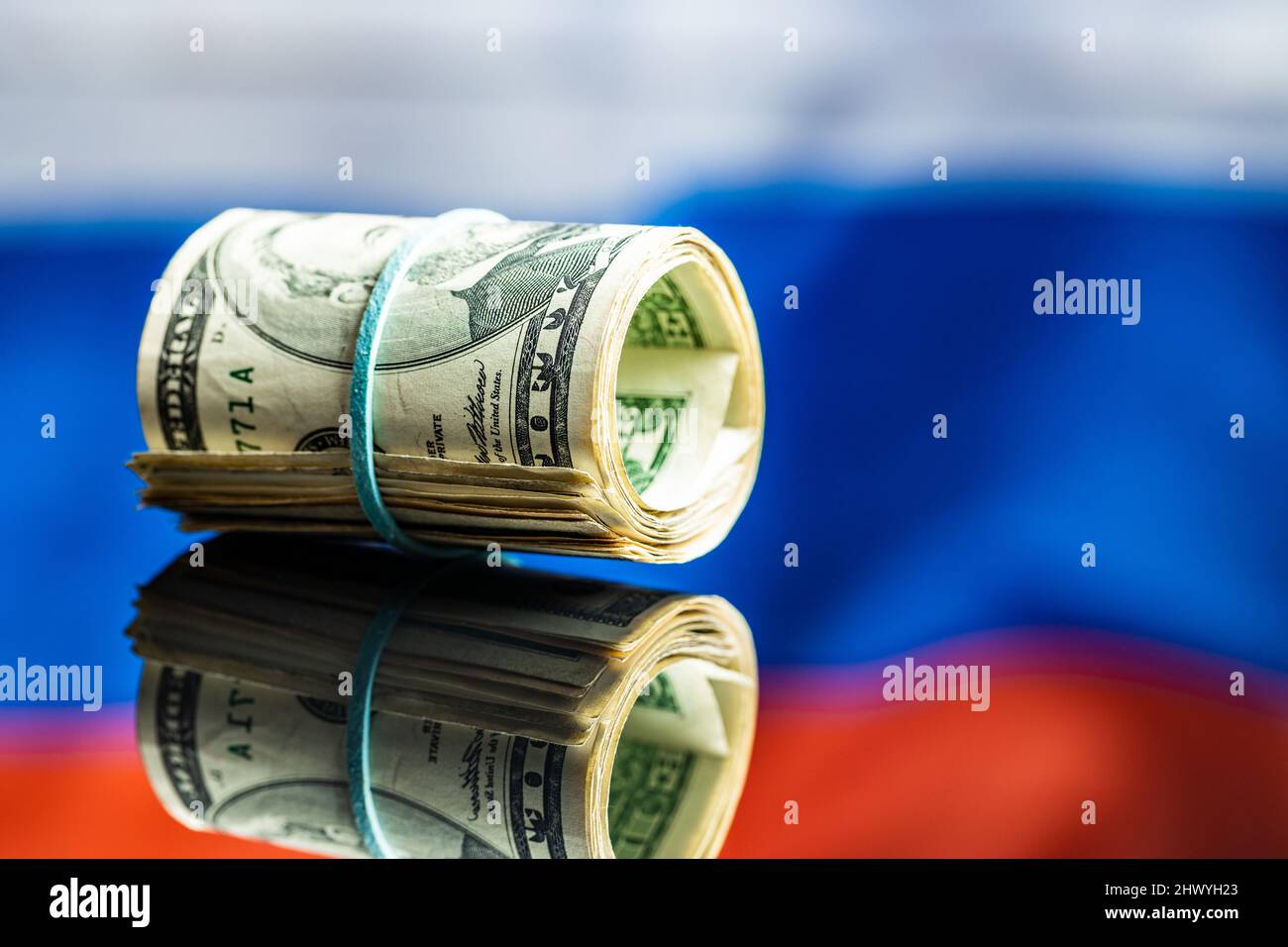 Dollar banknotes in front of Russian flag. The paper US currency Stock ...