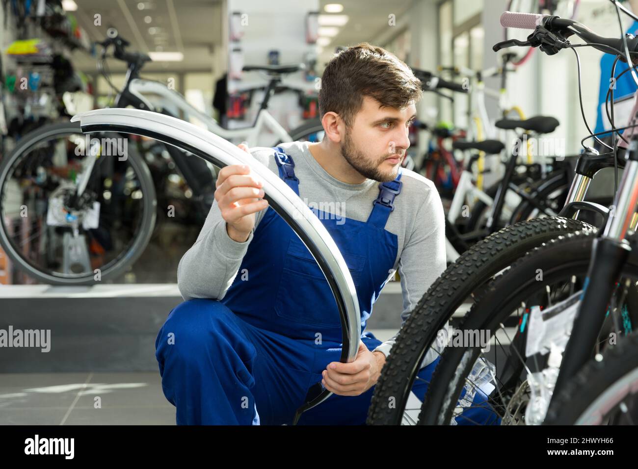 Young professional man holding cycle frame Stock Photo - Alamy