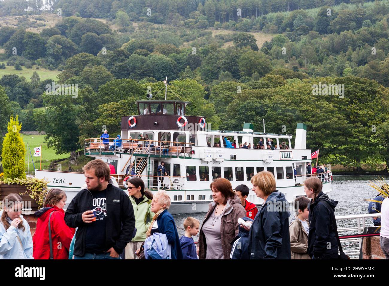 The steamer Teal approaches the dock at Lakeside, Windermere, as the ...