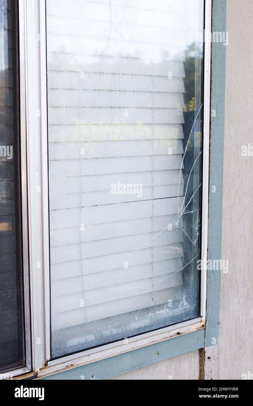 Broken house window in need of repair Stock Photo - Alamy