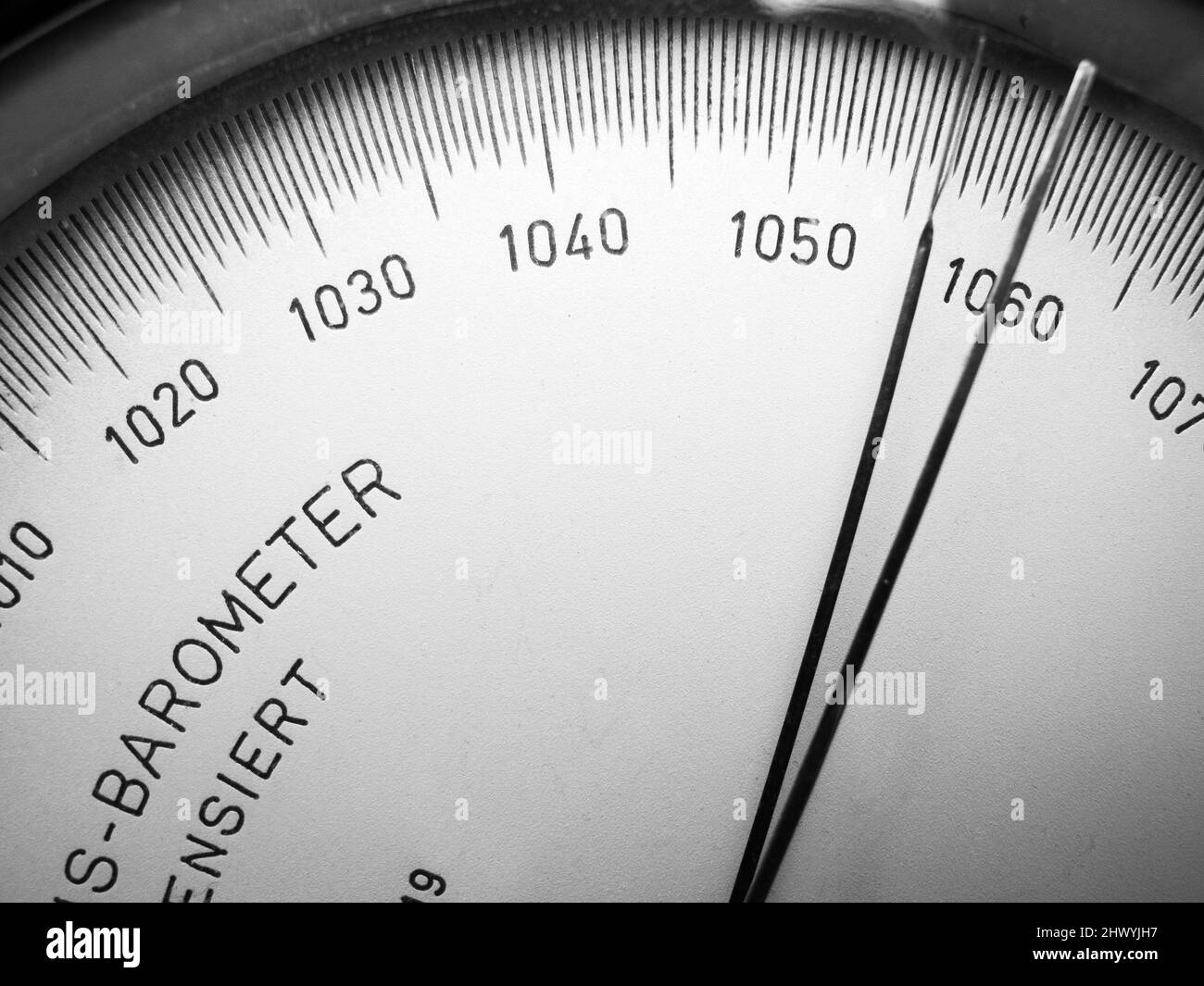 Close-up view of the scale with pointer of an analogue barometer ...