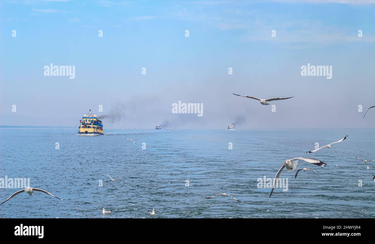Small tourist ship with passengers. Beautiful seascape with a tourist ...