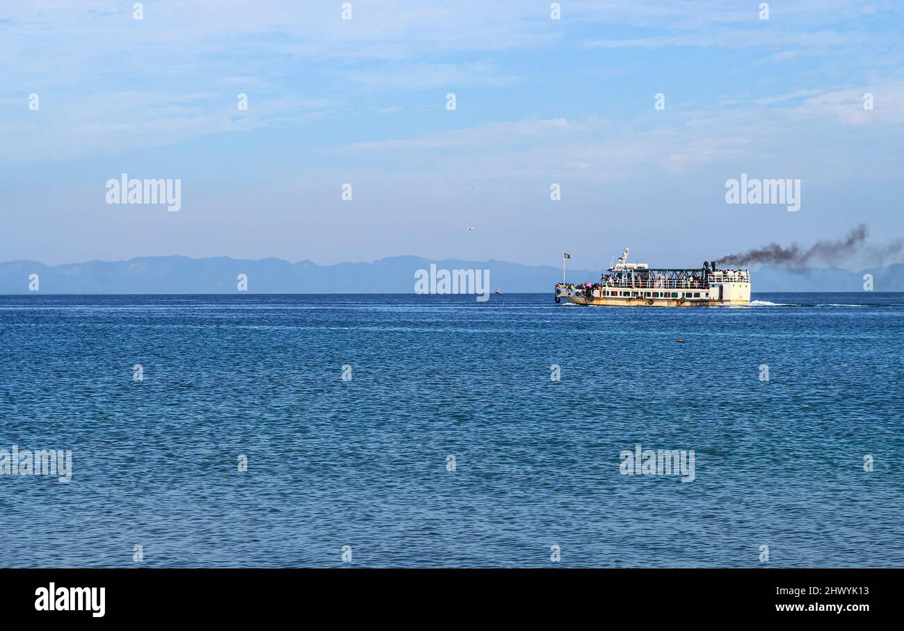 Small tourist ship with passengers. Beautiful seascape with a tourist ...