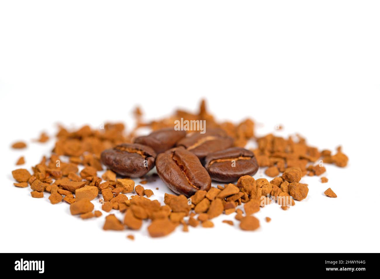 Instant coffee beans against a white background Stock Photo - Alamy