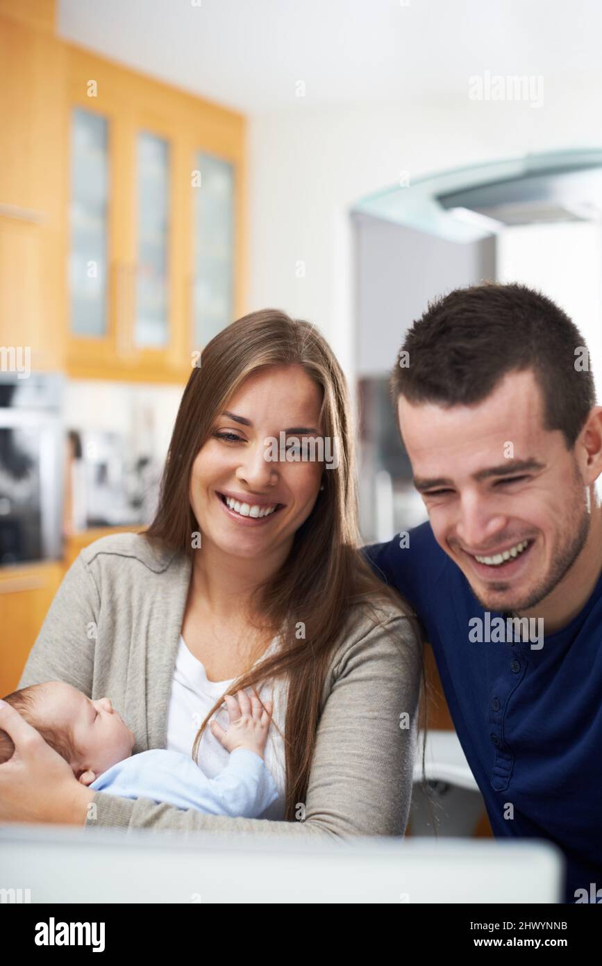Our little angel. A young couple and their newborn baby Stock Photo - Alamy