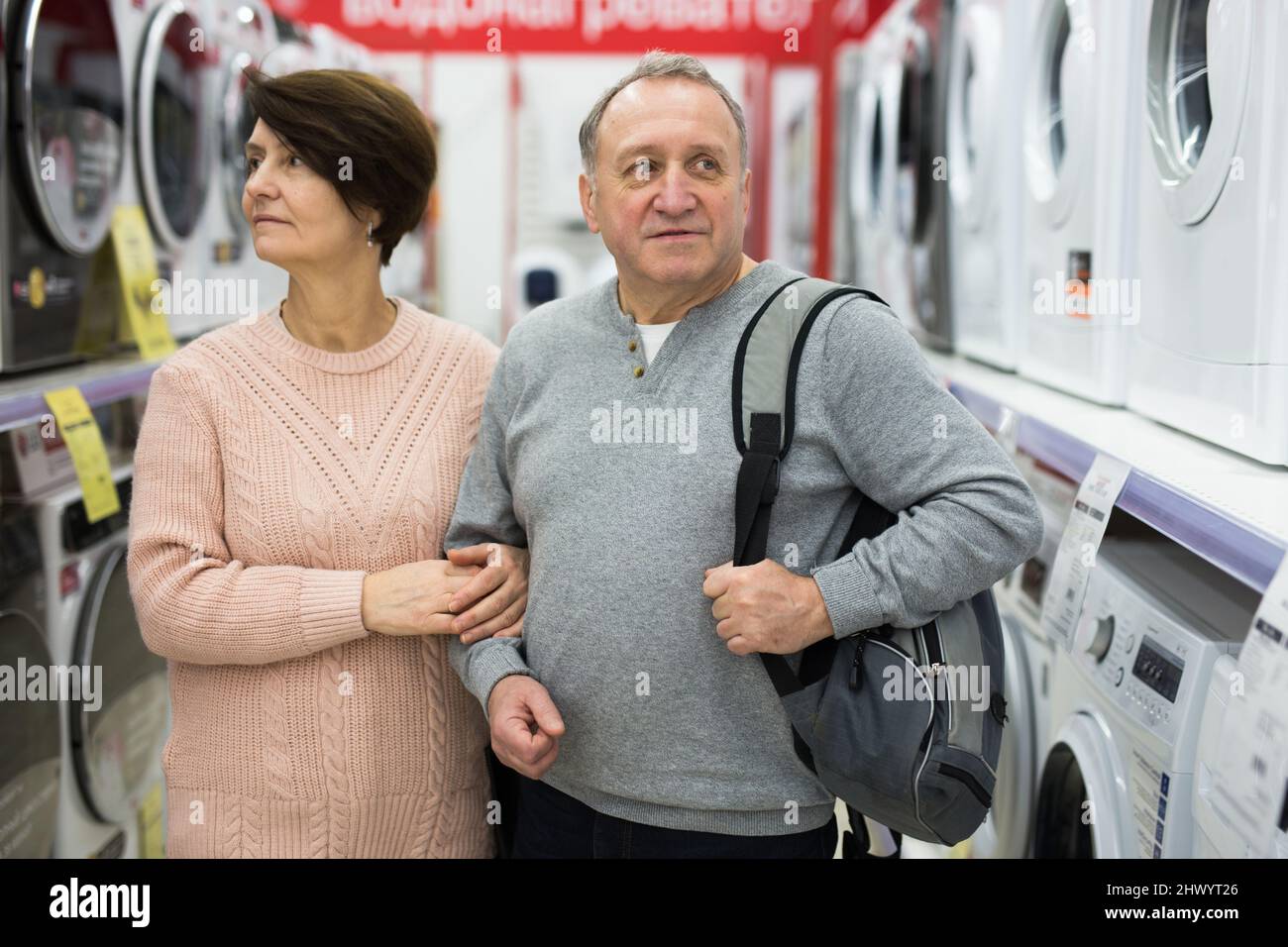Mature woman washing machine hi-res stock photography and images - Alamy