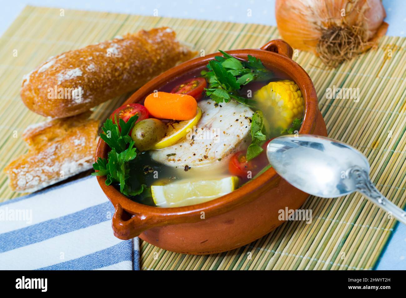 Fisherman's broth prepared with boiled pollock, carrots, corn and ...