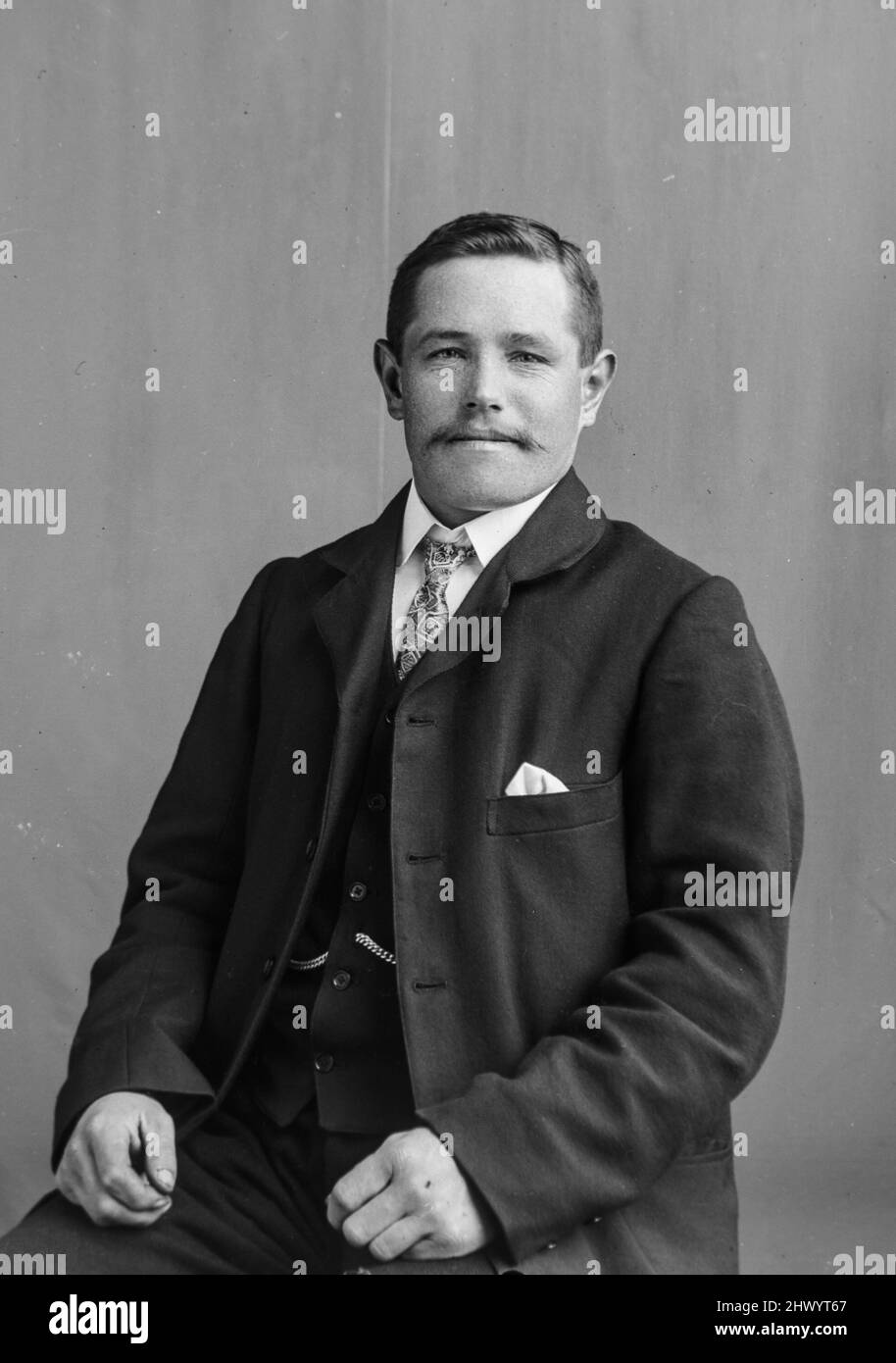 Edwardian formal studio portrait of a man in a dark suit. Taken from a ...