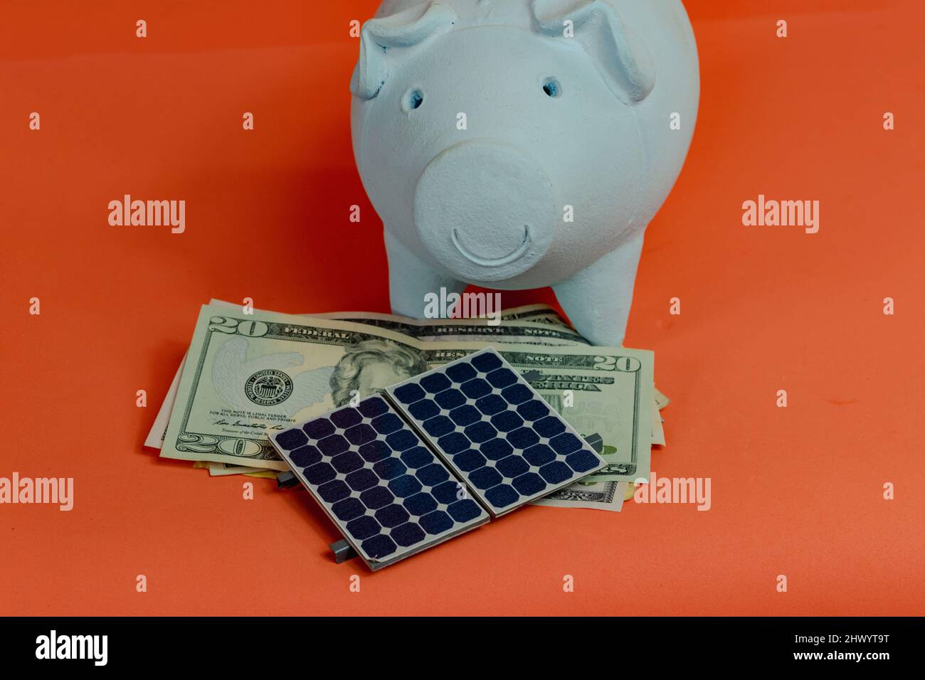 Piggy bank with dollar bill and photovoltaic solar panel isolated on ...