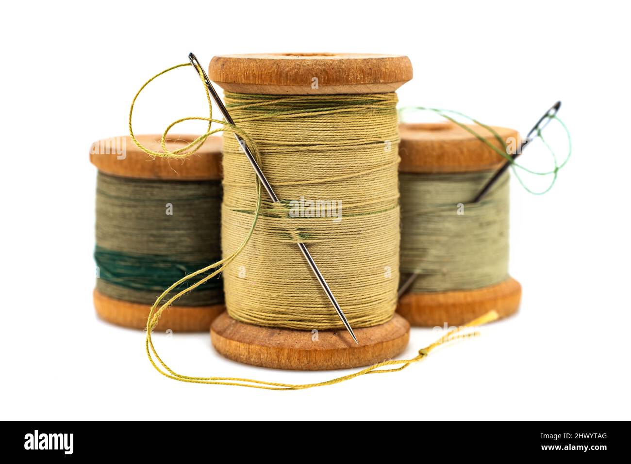 Vintage retro spool of thread on a white background. Needle with thread ...